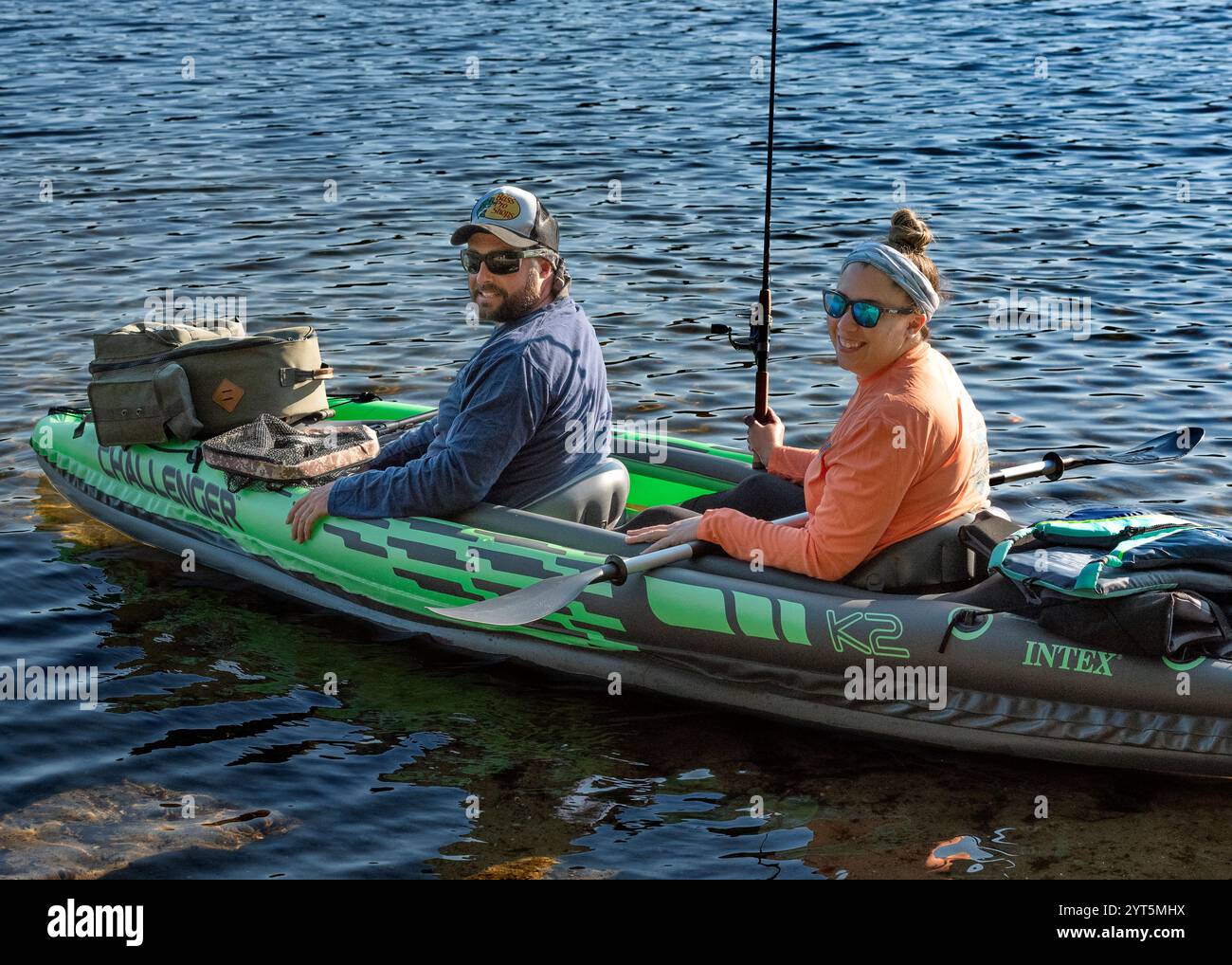 Couple fishing from inflatable kyak Stock Photo - Alamy