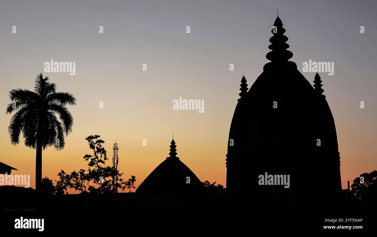Evening silhouettes of Shiva Dol, Sivasagar, Assam, India Stock Photo ...