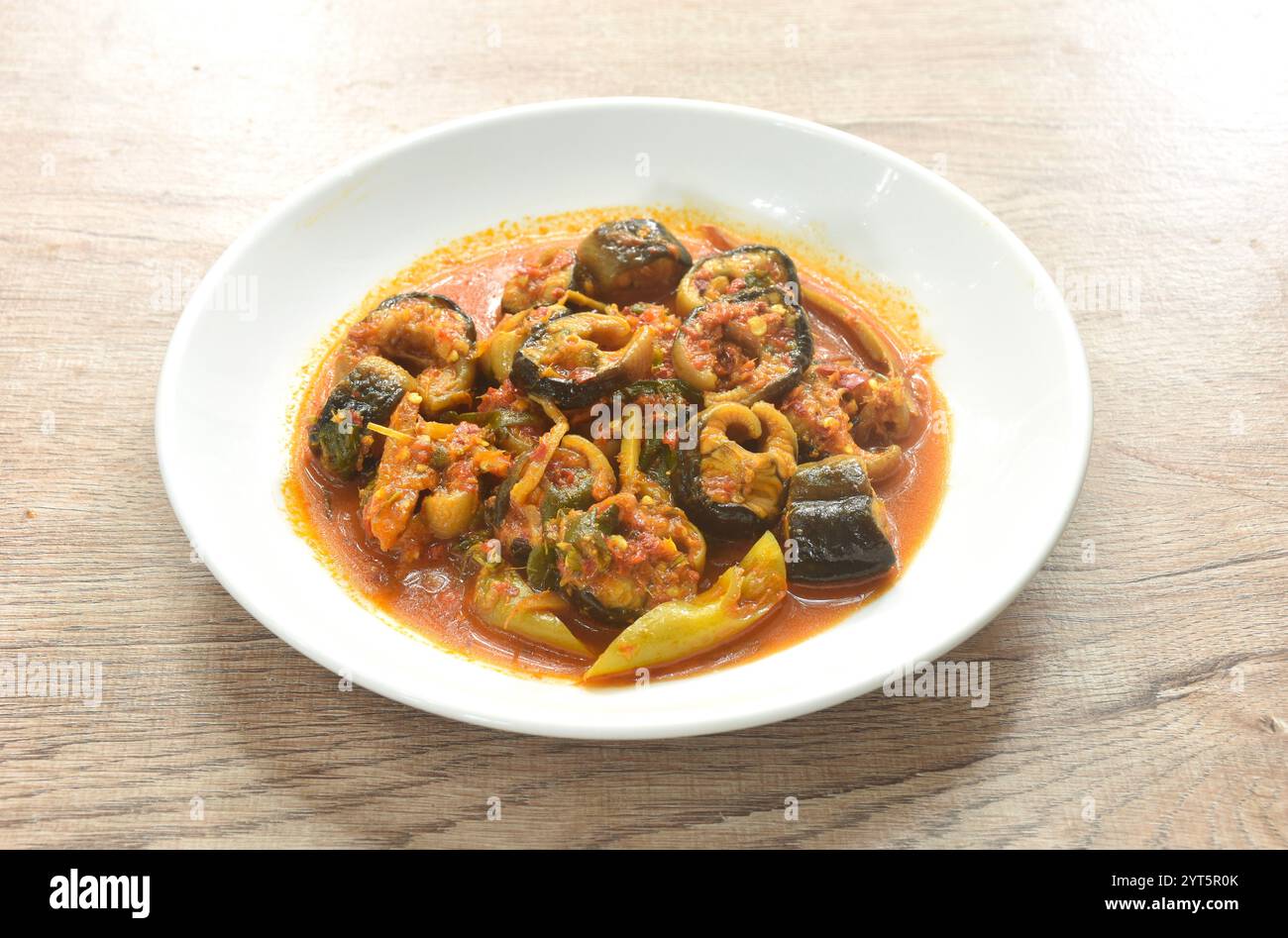 spicy fried slice eel fresh water fish with curry and herb on plate ...