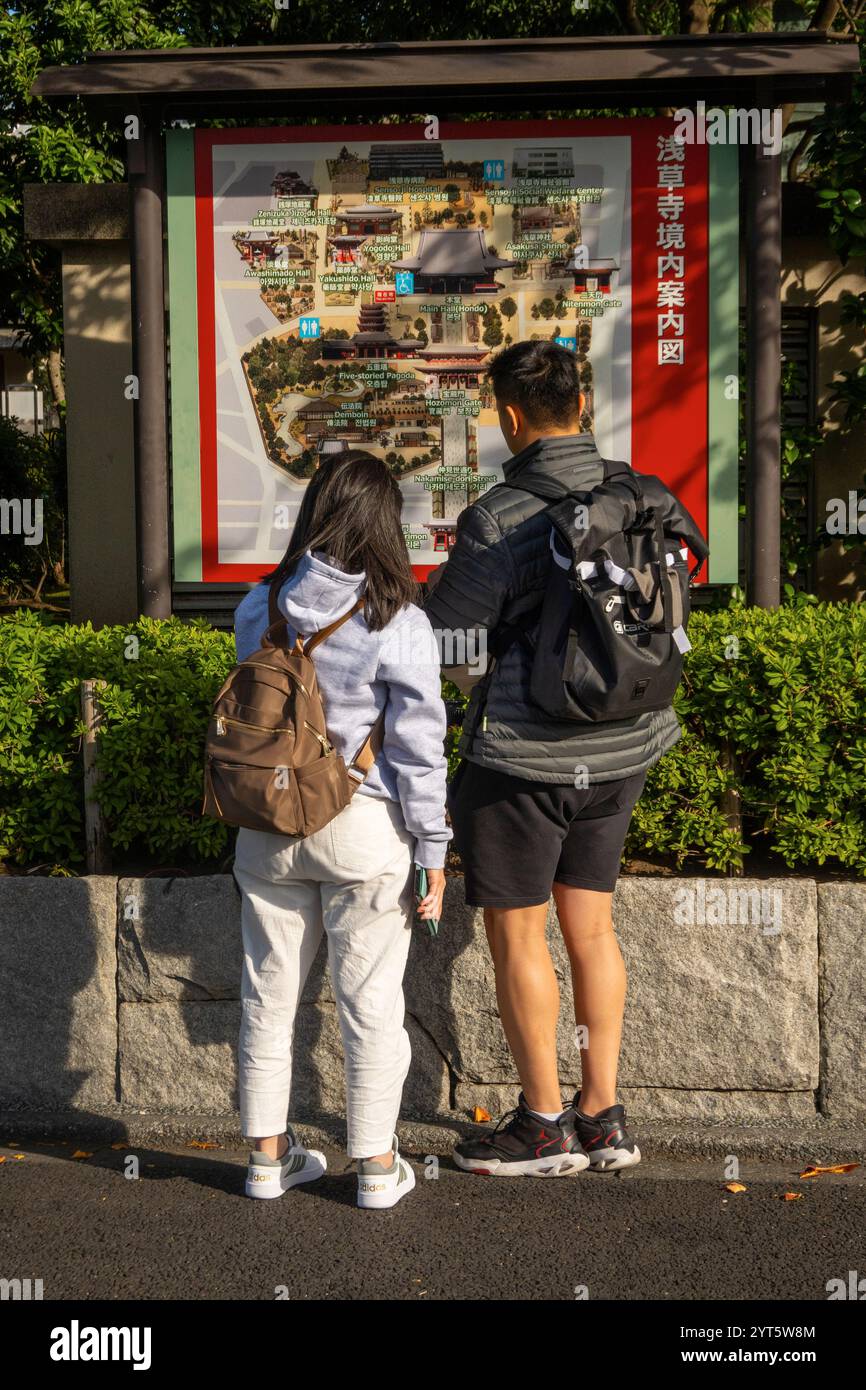 couple reading a map at the Senso-ji temple in Asakusa Taito Ku in Tokyo Japan Stock Photo - Alamy