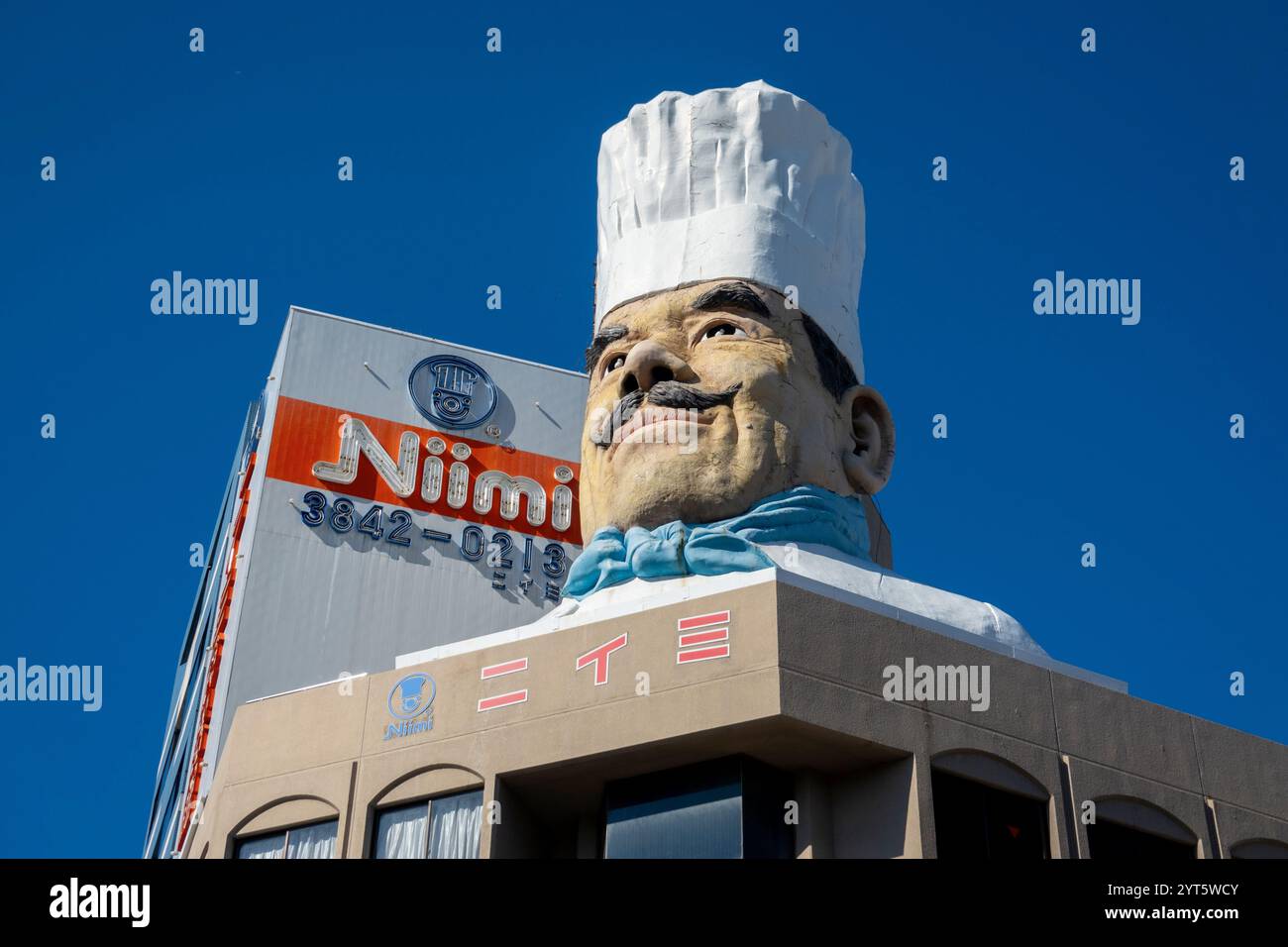 Niimi Company building with a jumbo cook sculpture on the roof on ...