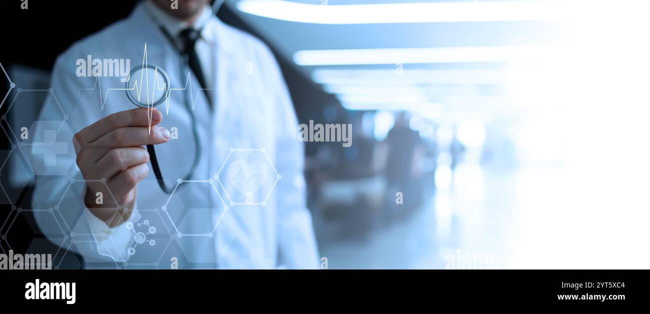 A doctor holds a stethoscope, standing against a hospital interior ...