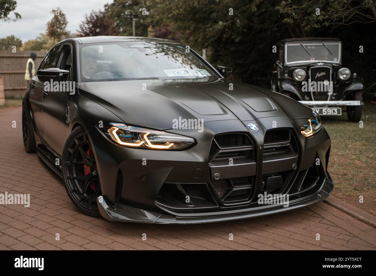 Matt Black BMW G80 M3 at a car meet Stock Photo - Alamy