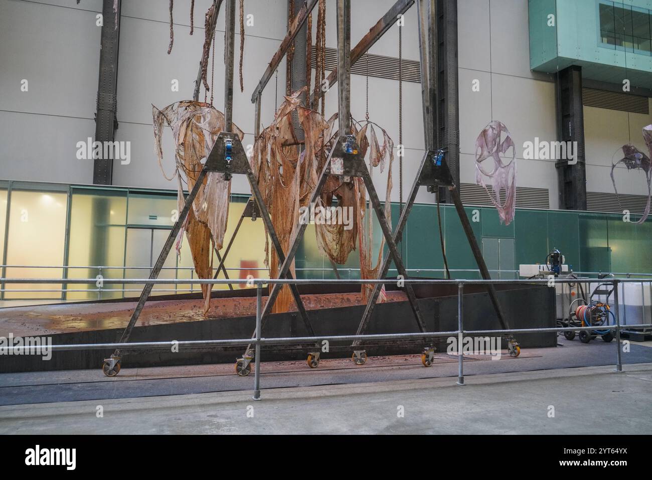 Open Wound with fabric hanging sculptures and mechanical installations ...