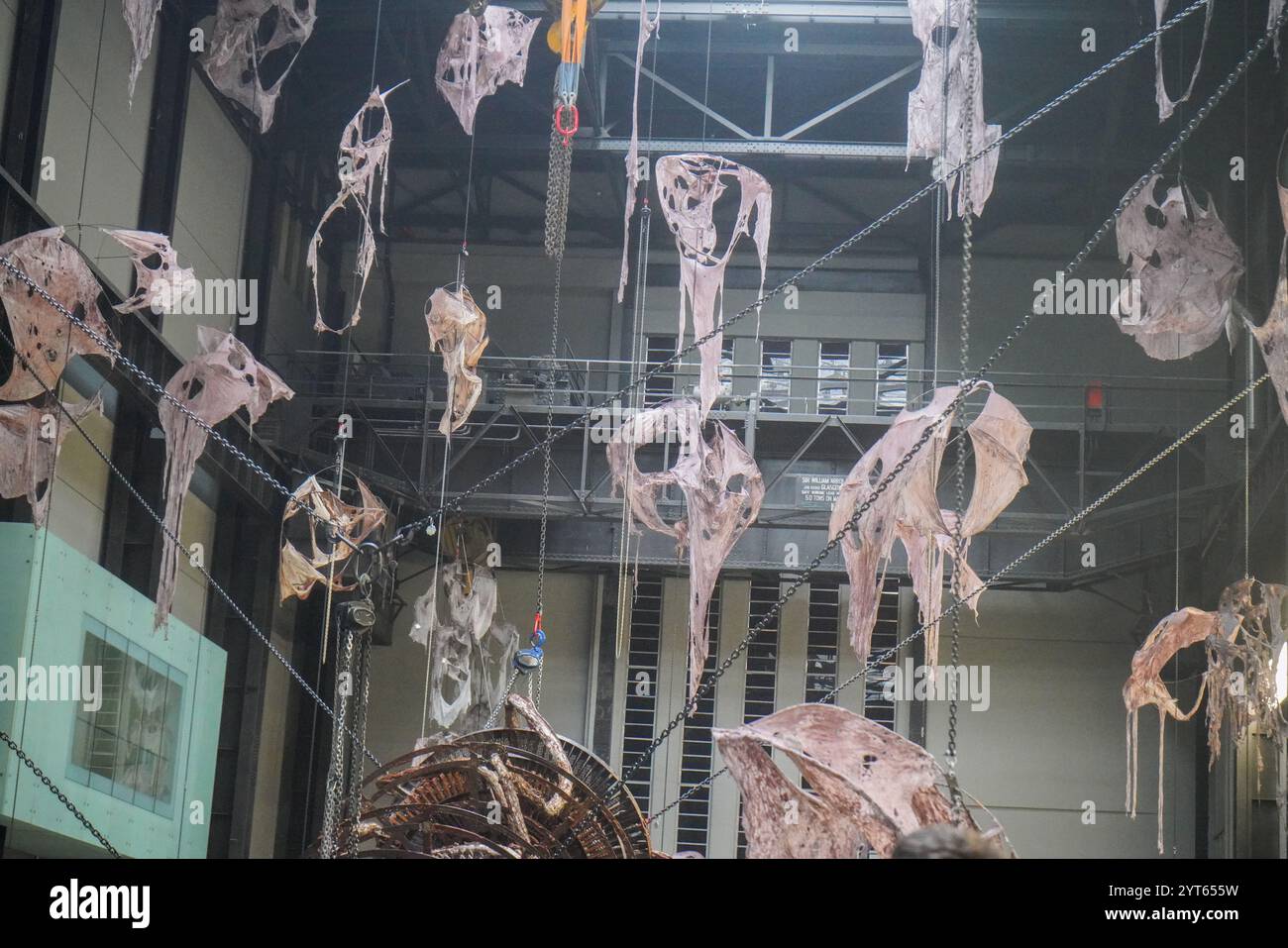 Open Wound with fabric hanging sculptures and mechanical installations ...