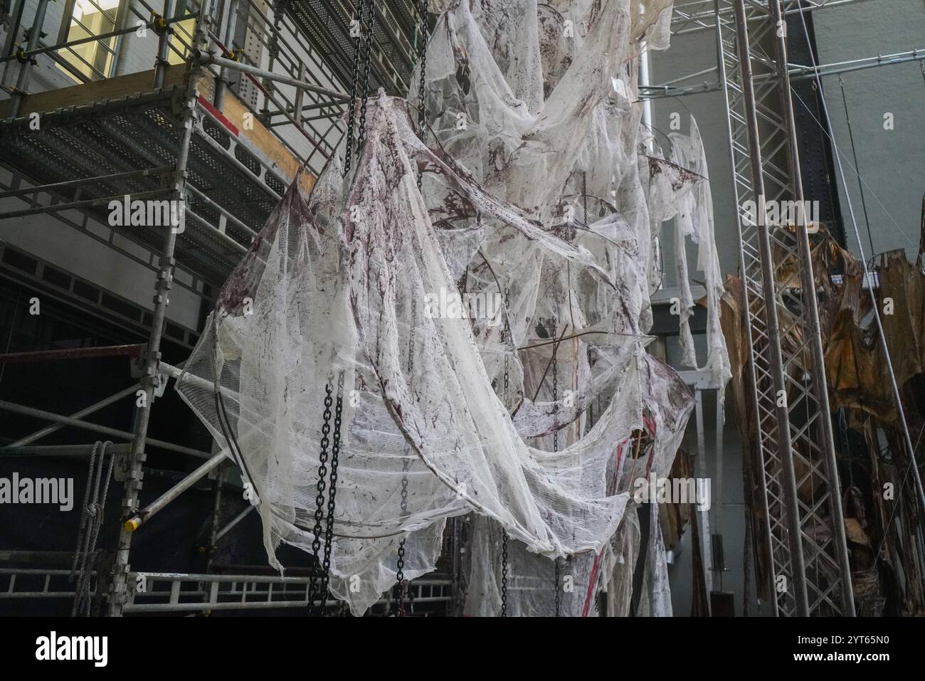 Open Wound with fabric hanging sculptures and mechanical installations ...