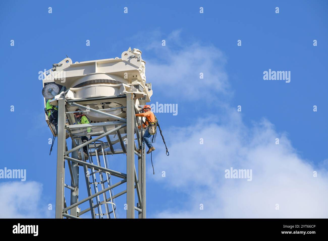 NEW ORLEANS, LA, USA - DECEMBER 9, 2023: A trio of construction workers ...