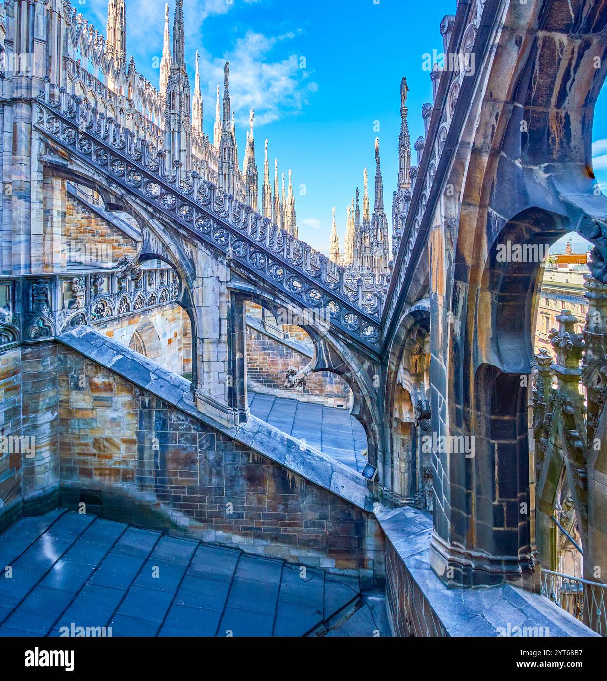 Stone Carved flying buttresses in Gothic style on the roof of Milan ...