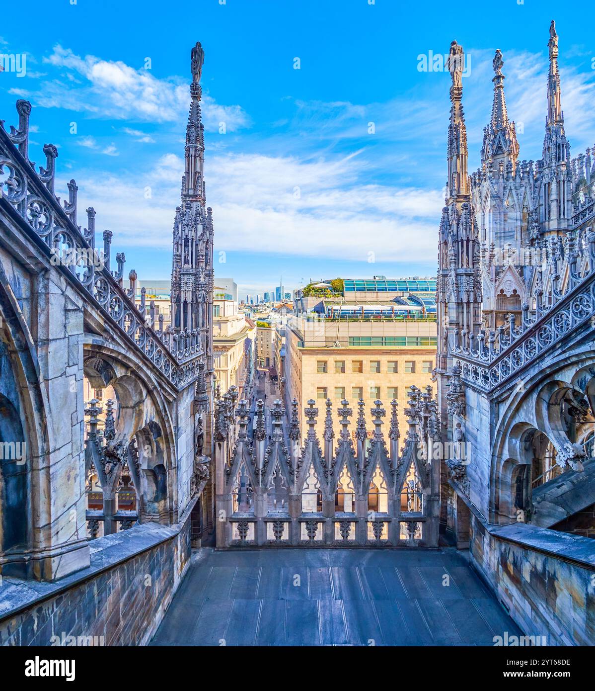 The view through the Gothic flying buttresses of Milan Cathedral ...