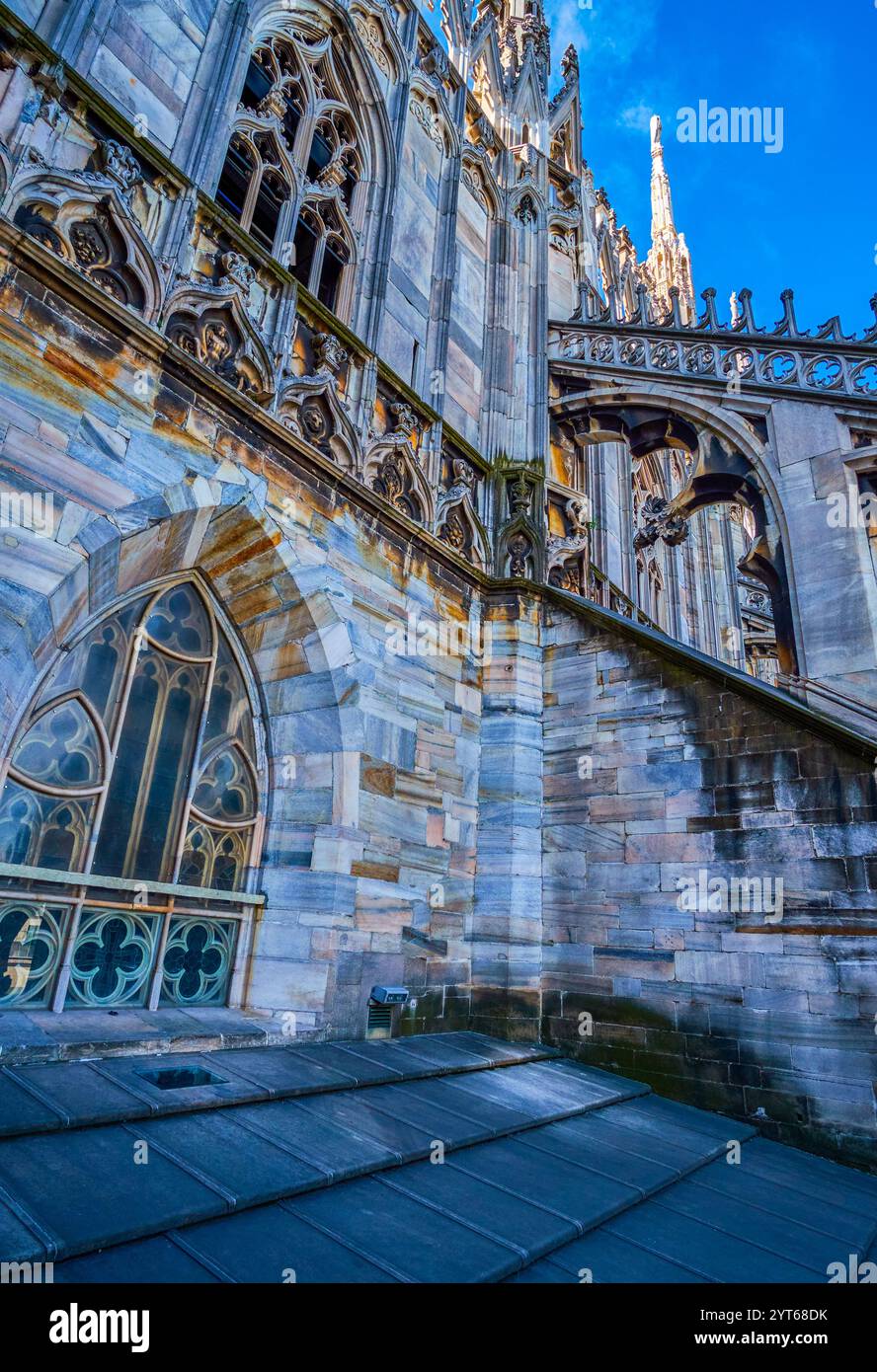 The Gothic style window with stone frames is seen on the roof of Milan ...
