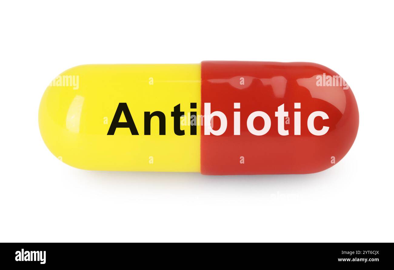 Capsule with word Antibiotic on white background Stock Photo - Alamy
