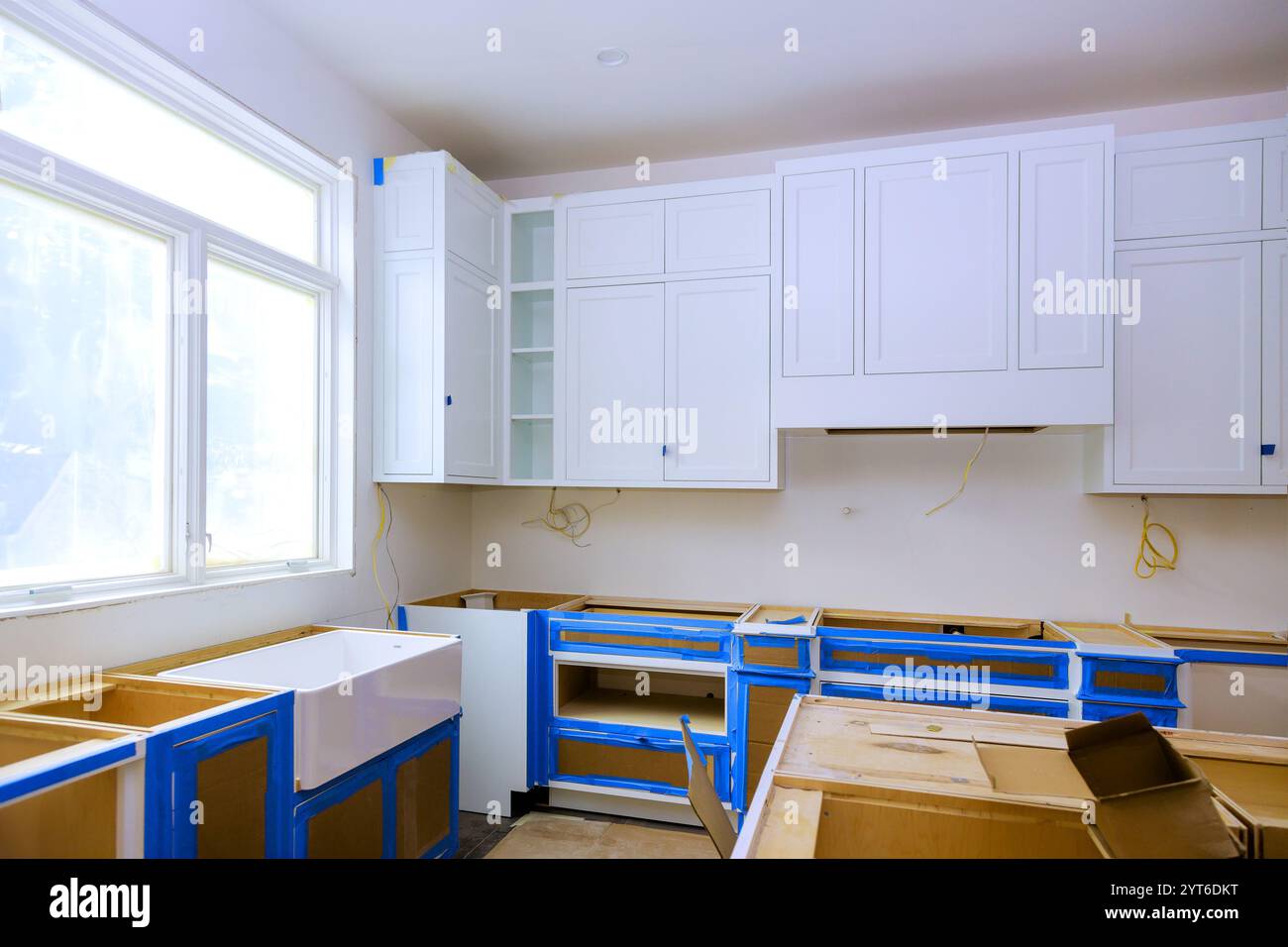New kitchen construction underway featuring white cabinets house sink ...