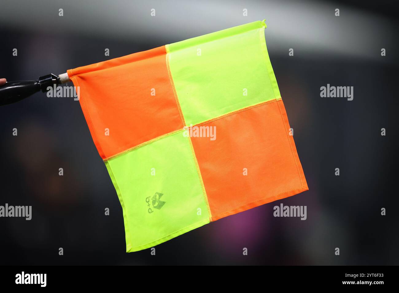 Milan, Italy, 26th November 2024. A linesman’s flag during the UEFA ...