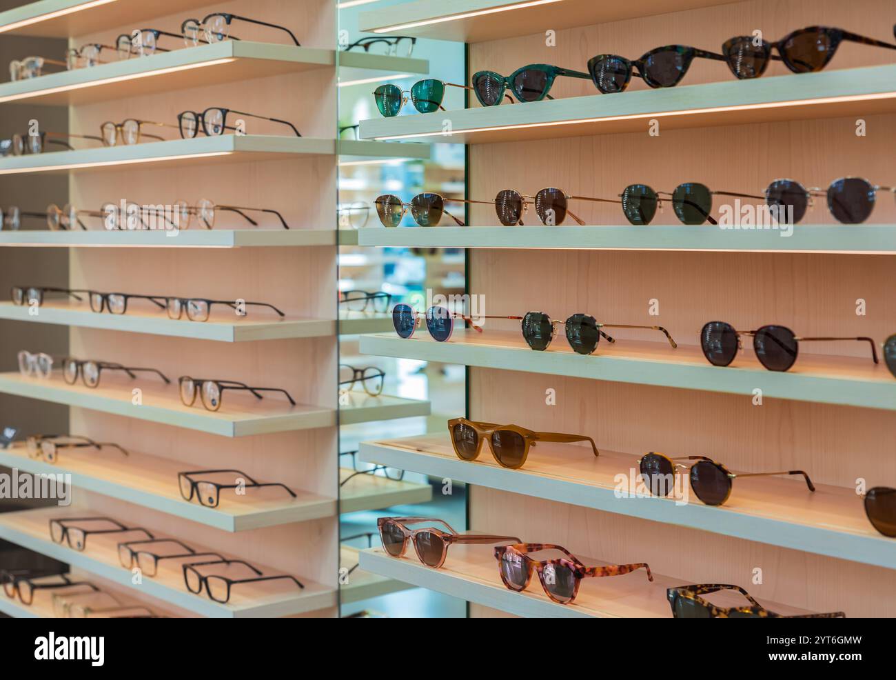 Storefront shelves of various modern sunglasses in retail store ...