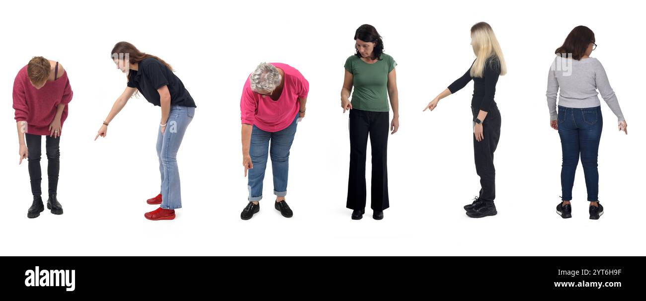 group of women pointing fingers at the ground on white background Stock ...