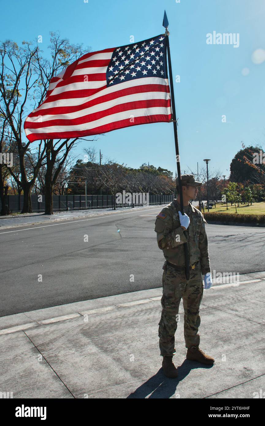 Member of U.S. Army holds the national flag during the the opening ...