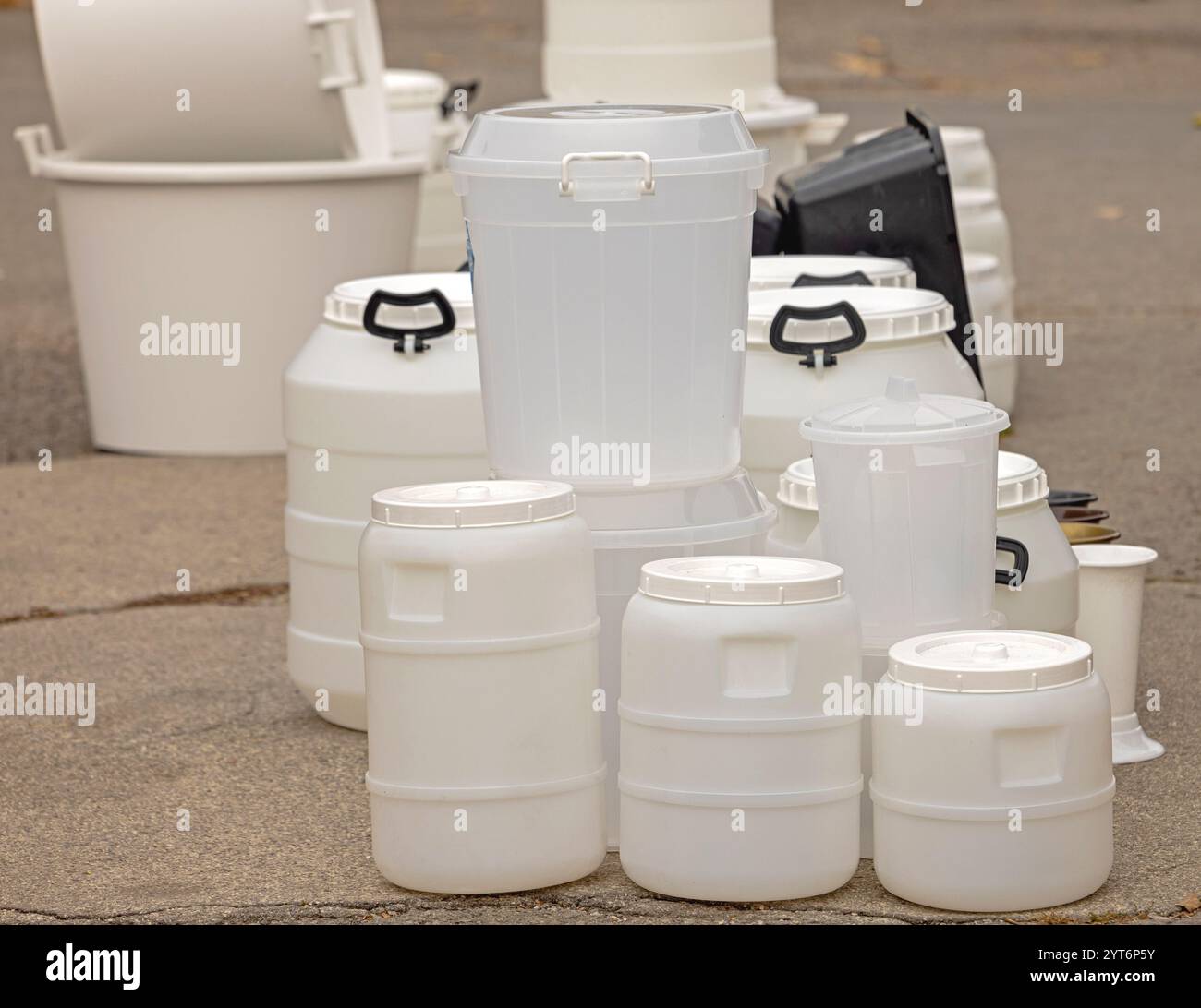Various Size and Shape of White Plastic Barrels Drums Gallon Containers ...