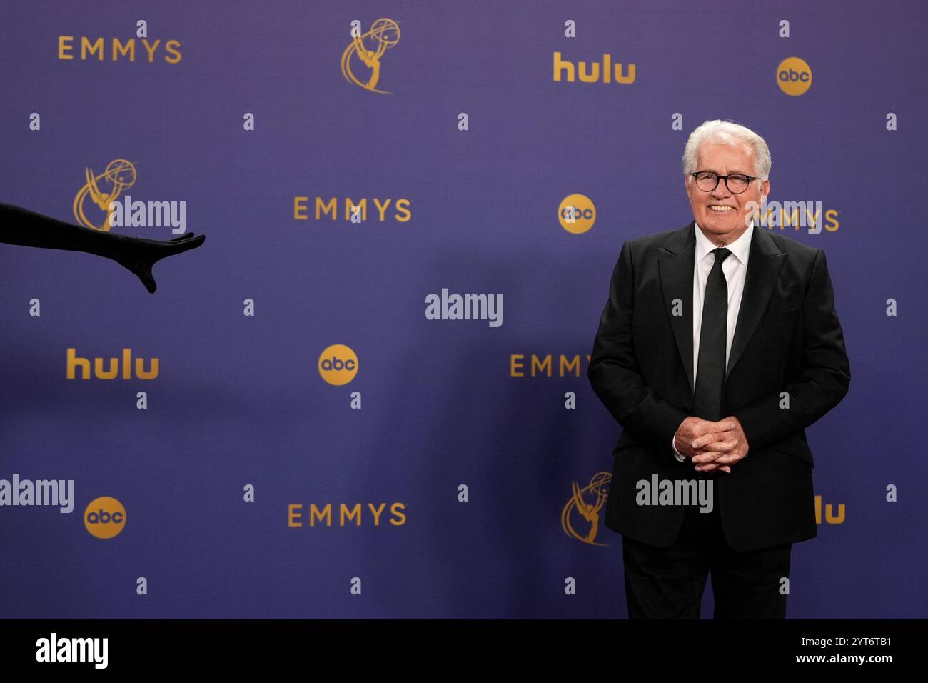 Allison Janney, left, and Martin Sheen pose in the press room during ...