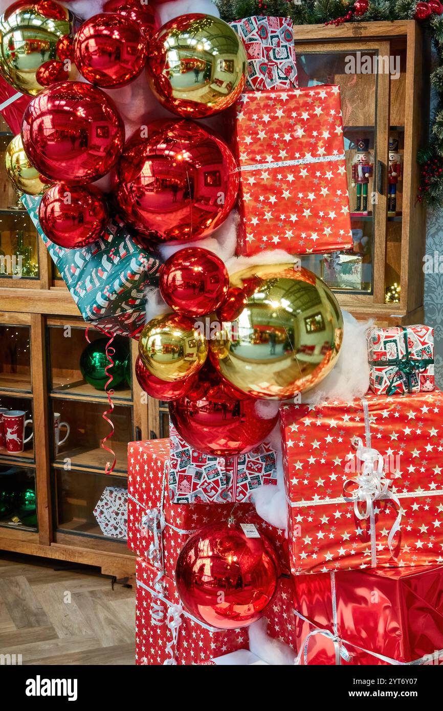Christmas trees and decorations with festive window displays Stock ...