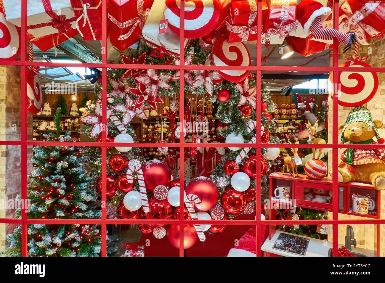 Christmas trees and decorations with festive window displays Stock ...