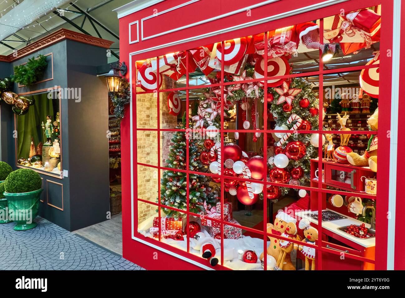 Christmas trees and decorations with festive window displays Stock ...
