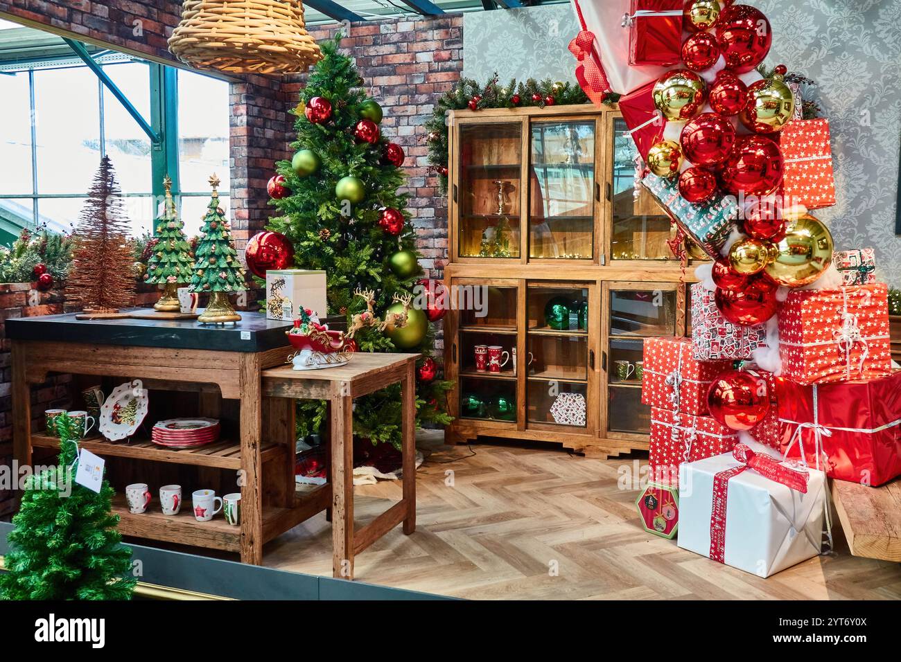 Christmas trees and decorations with festive window displays Stock ...