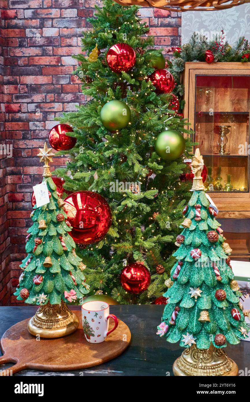 Christmas trees and decorations with festive window displays Stock ...