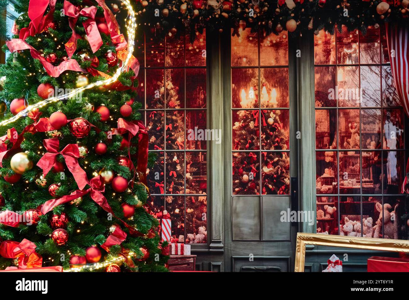 Christmas trees and decorations with festive window displays Stock ...