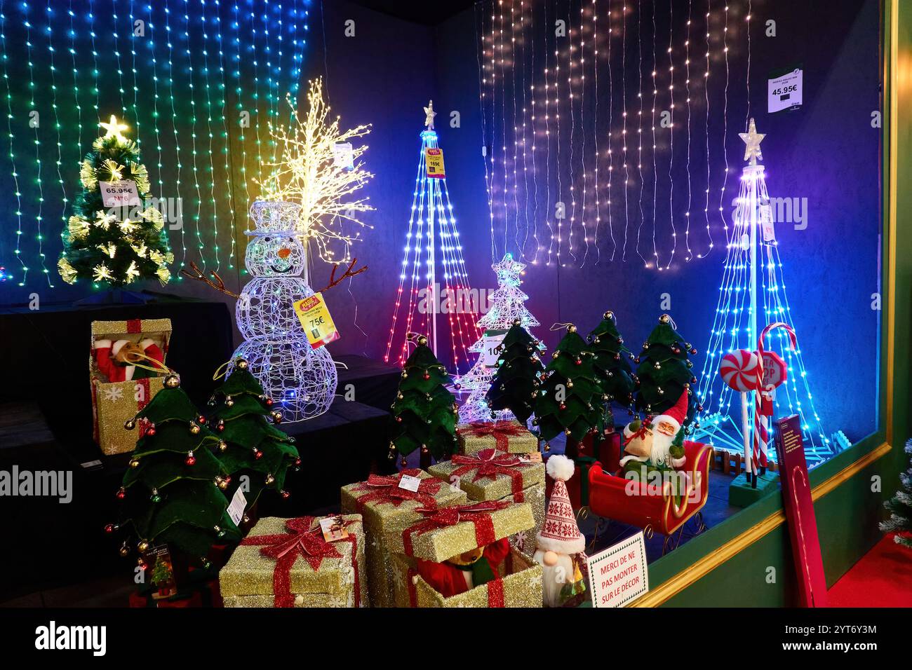 Christmas trees and decorations with festive window displays Stock ...