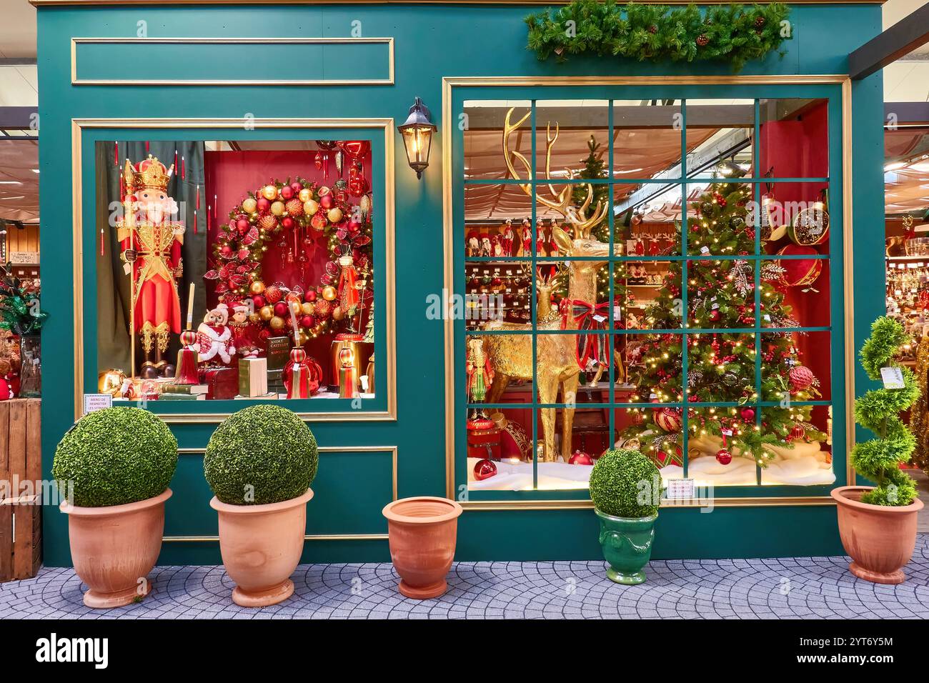 Christmas trees and decorations with festive window displays Stock ...