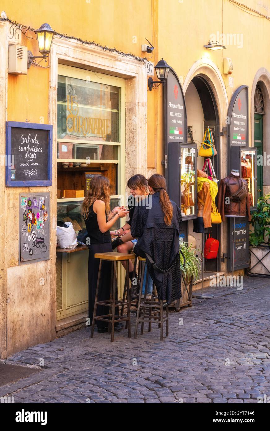 Three people at cafe in italy hi-res stock photography and images - Alamy