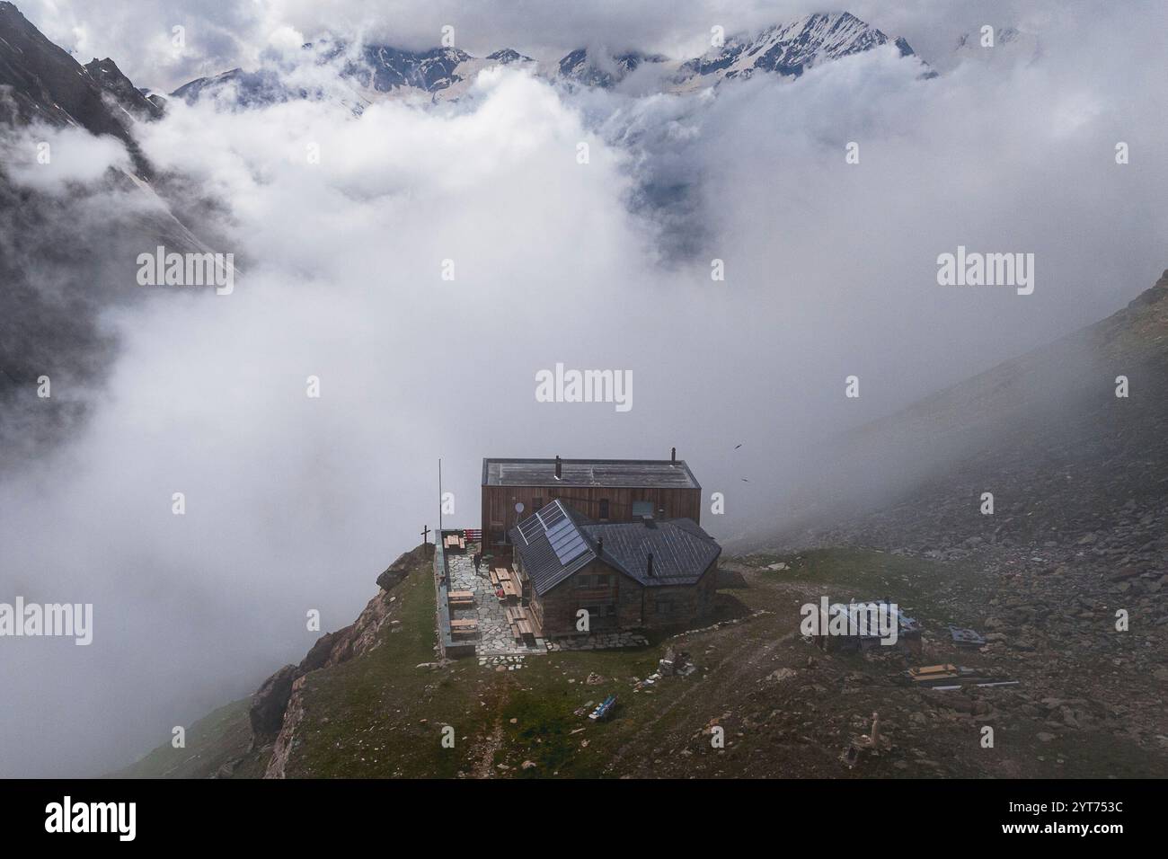 A bird's eye view of the Täschhütte in Valais, Switzerland. Clouds rise ...