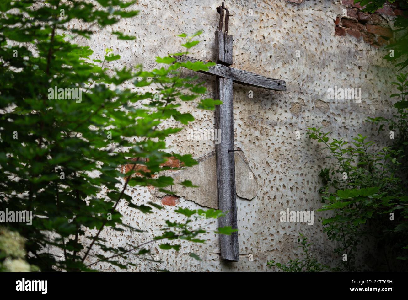 Very old cross is attached to the wall Stock Photo - Alamy
