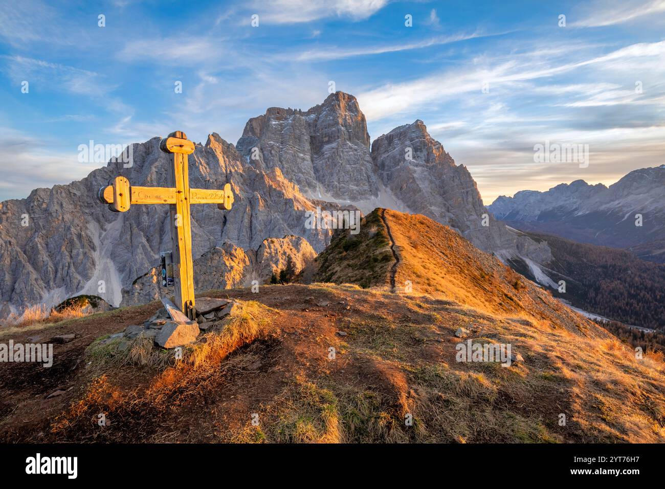 The Col de la Puina with its summit cross, in front of the Pelmo alpine ...