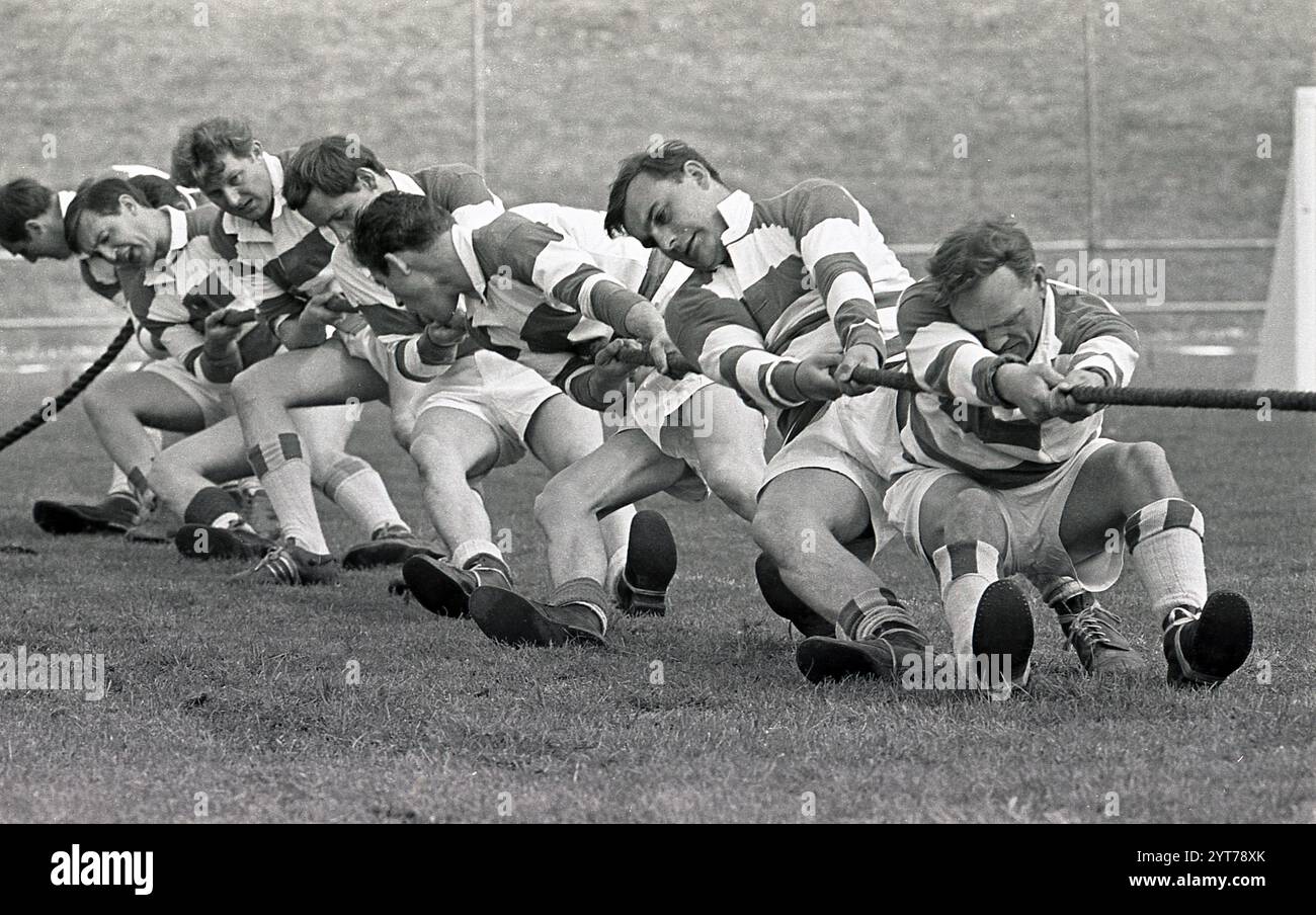1968, historical, a team of men, in hooped rugby jerseys and shorts ...