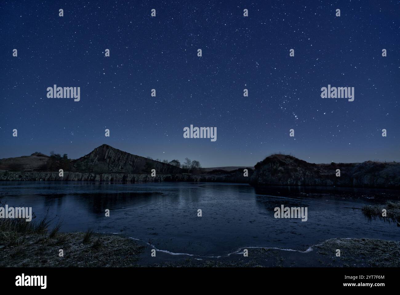 Hadrian's Wall (Cawfield Quarry) under a wintry, starry night sky with ...