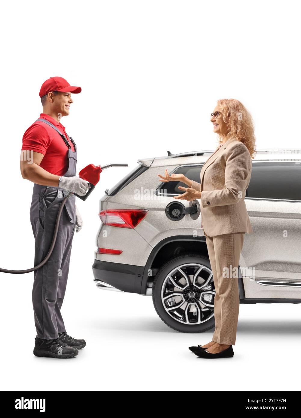 Female driver with a suv and a petrol station worker having a ...