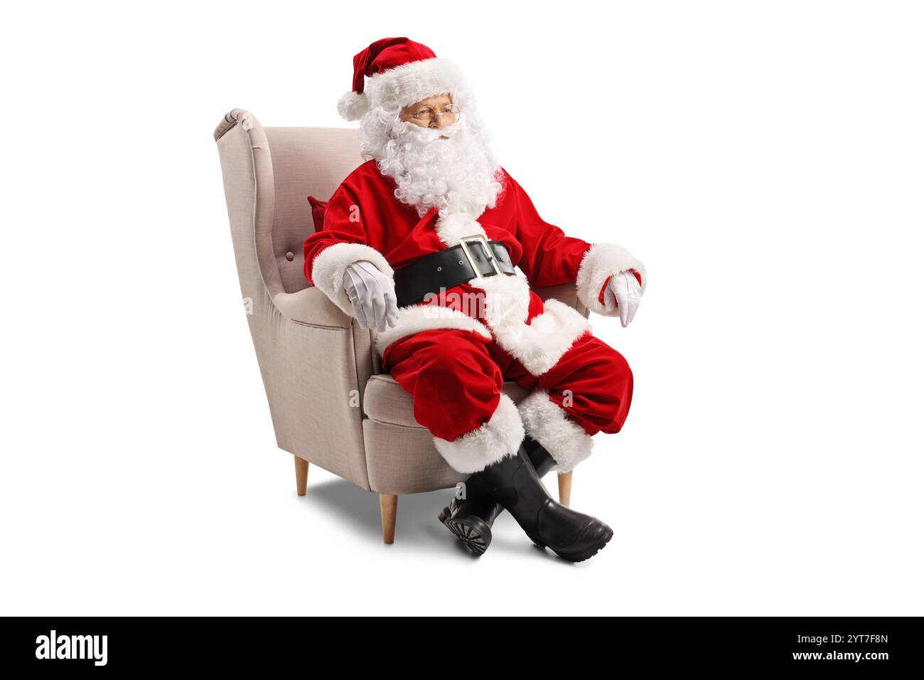 Santa claus sitting in an armchair isolated on white background Stock ...
