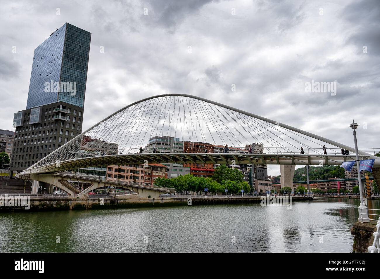 Bilbao, Spain- May 27, 2024: Zubizuri Pedestrian bridge over the river ...