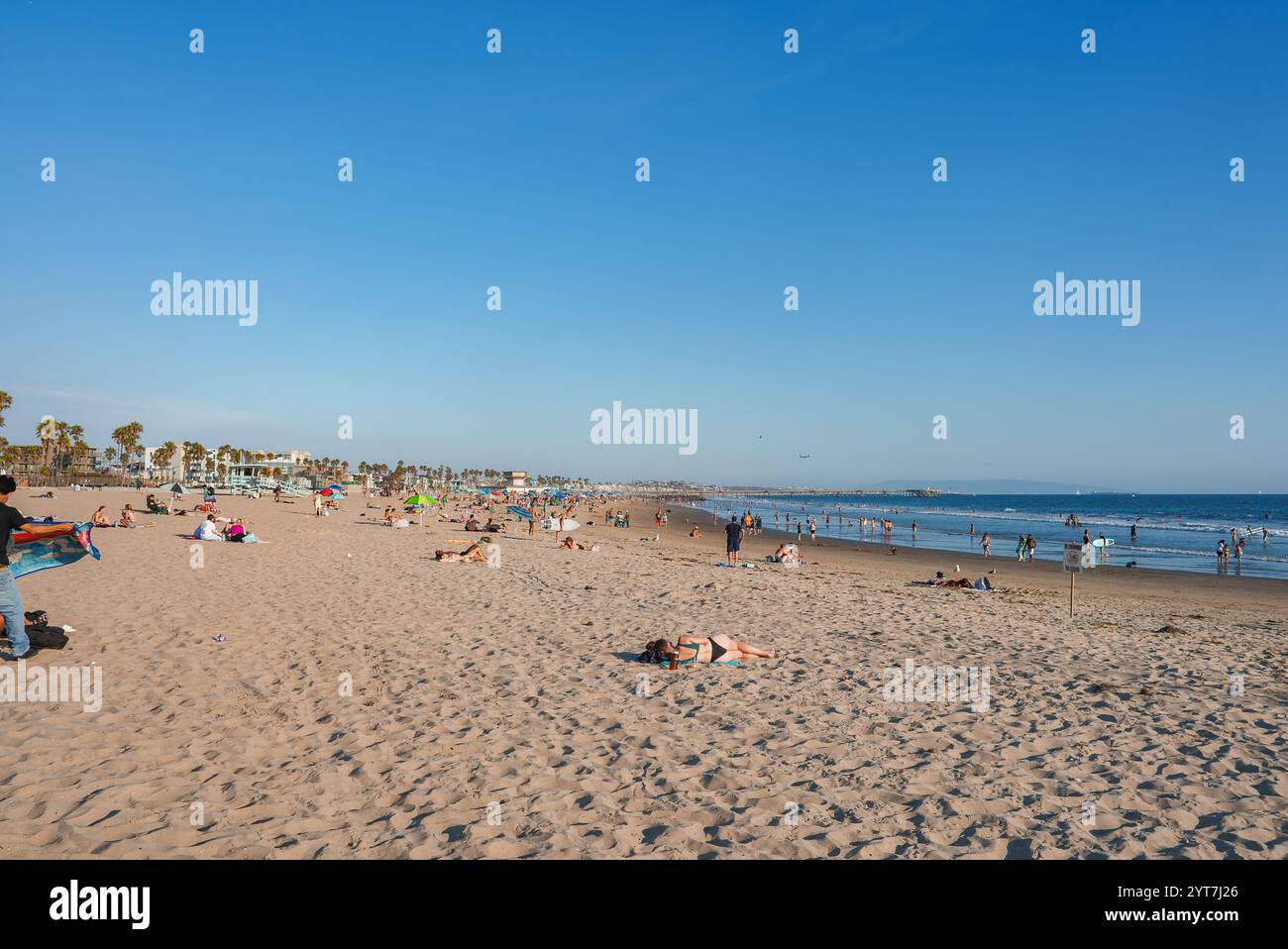 People enjoy sunbathing and walking on the sandy Venice Beach in Los ...