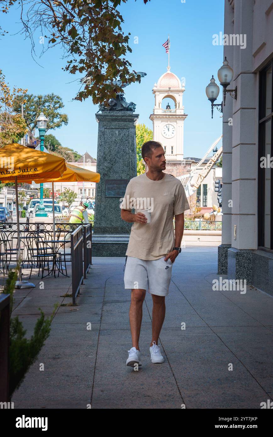 Man Walking Near Clock Tower in Downtown Santa Cruz, California Stock ...