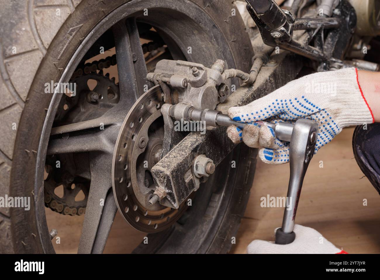 The process of replacing brake pads on a motorcycle. Maintenance ...