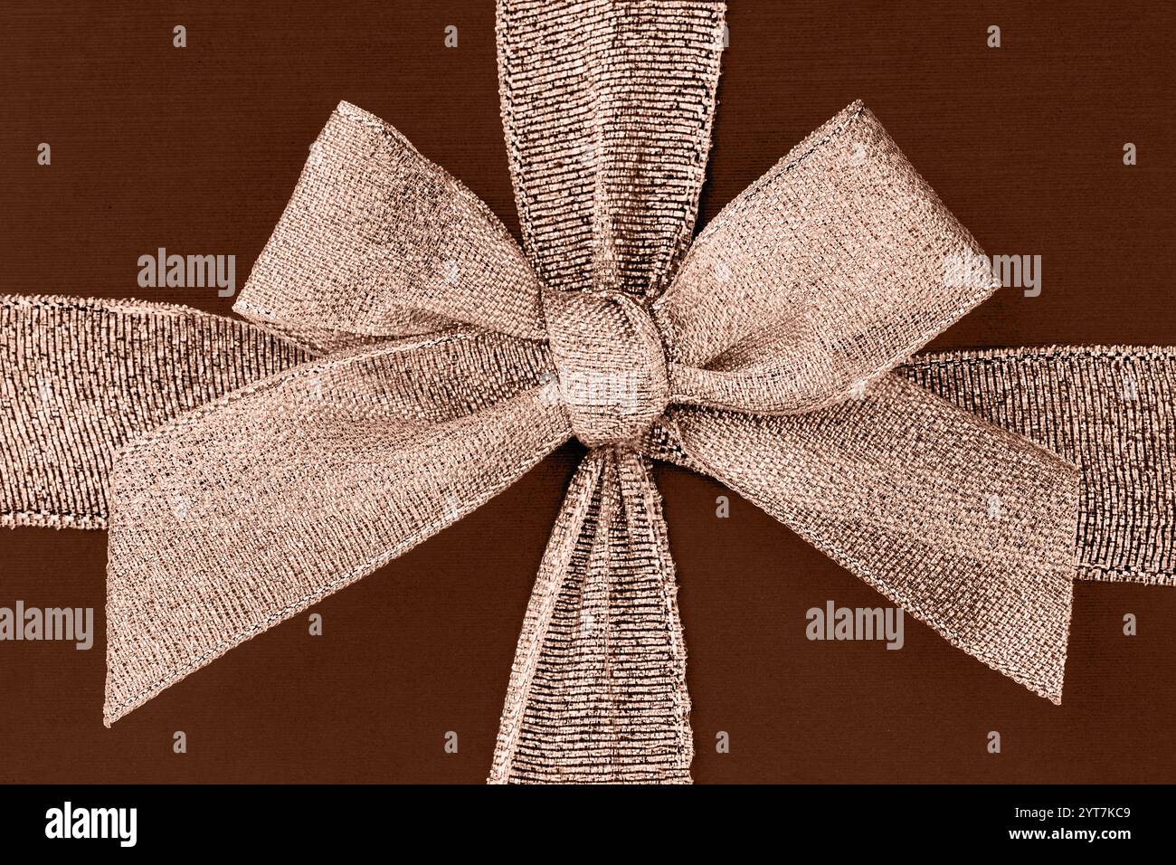 Brown mocha mousse gift box with ribbon and bow. Top view, background ...