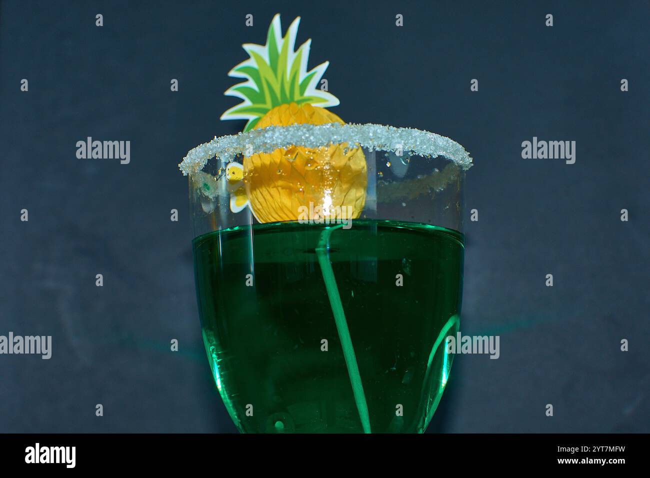 A stylish green liqueur served in a sugar-rimmed glass, enhanced with ...