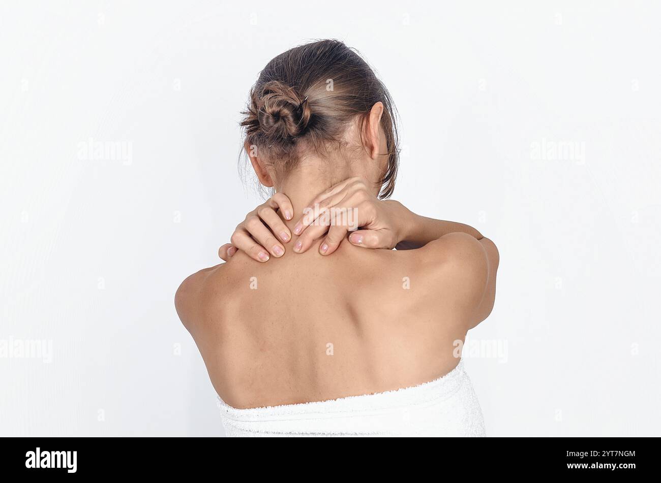 Detailed photo of a woman massaging her neck. Injury or muscle spasm ...