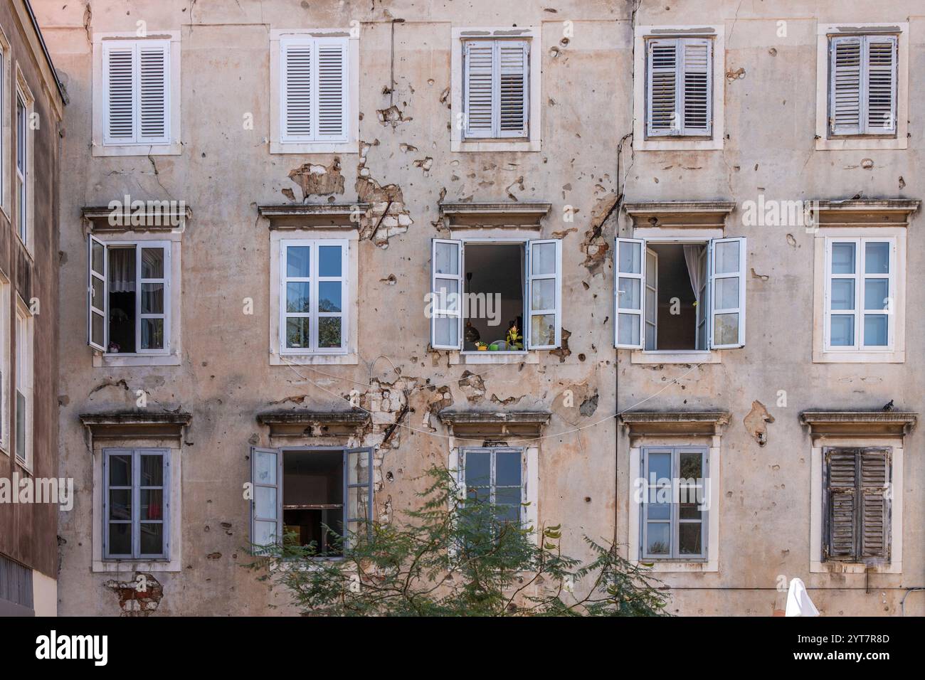 Window of an old building with bullet holes from the Balkan War. Window ...