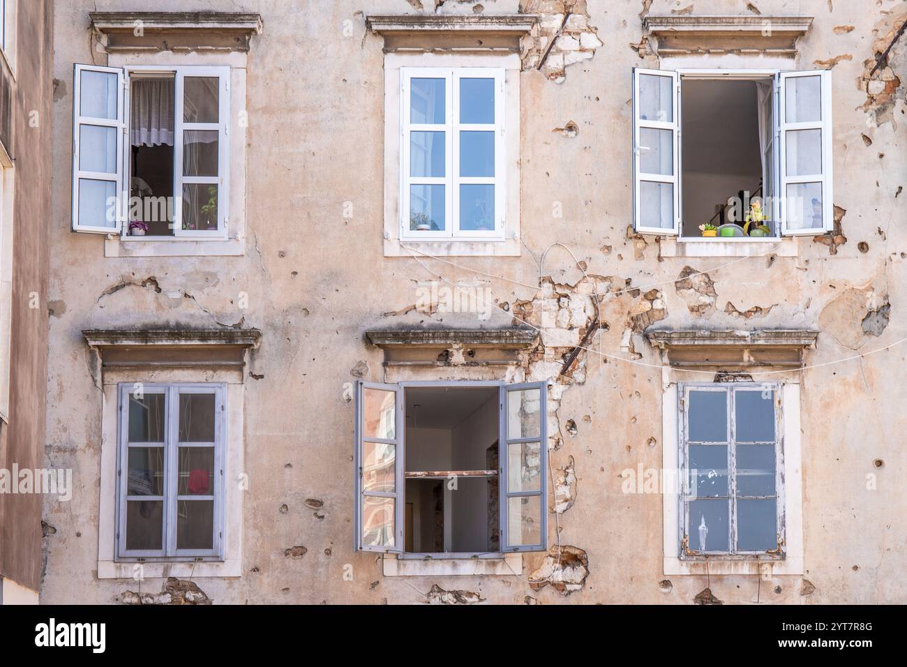 Window of an old building with bullet holes from the Balkan War. Window ...