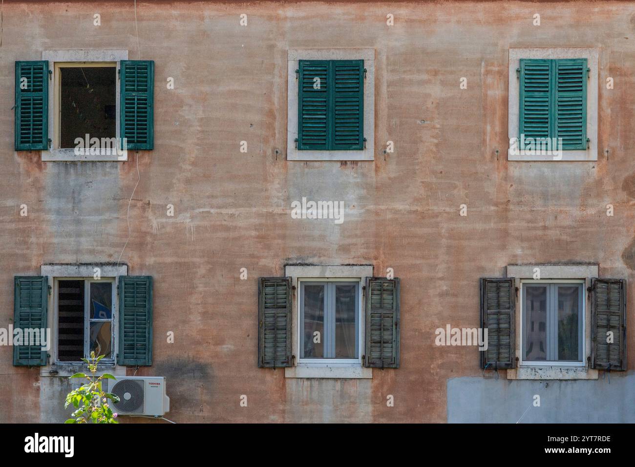 Window of an old building with bullet holes from the Balkan War. Window ...