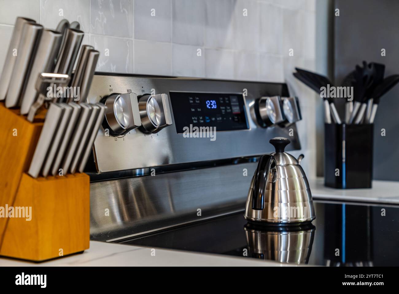 Stainless steel electric stovetop with glass top, digital display, and ...