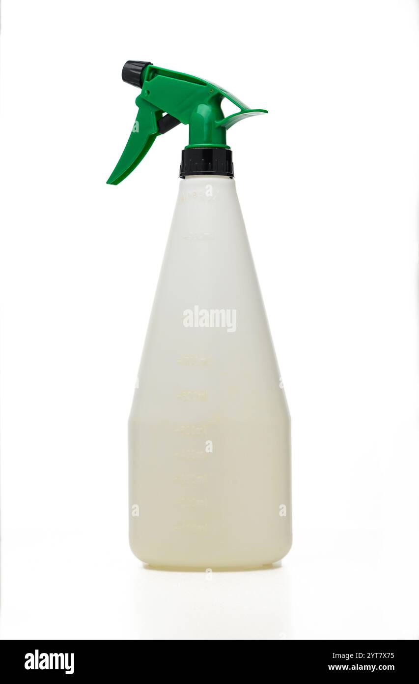 A modern spray bottle stands prominently, showcasing its sleek design ...